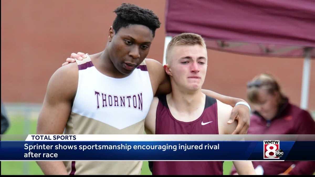 Race winner embraces injured sprinter