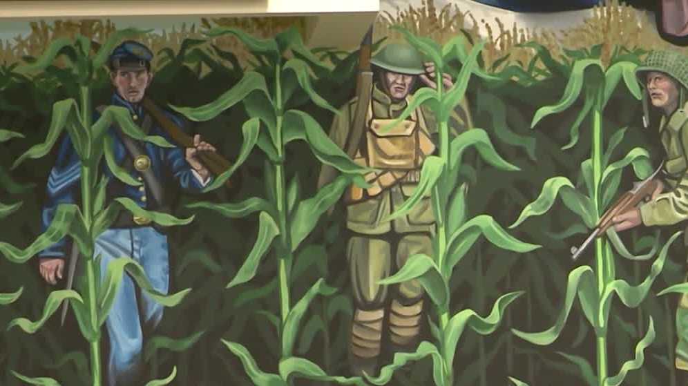 Freedom Rocks painter takes on mural inside Iowa American Legion