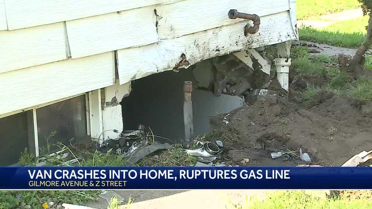Van crashes into home, ruptures gasline