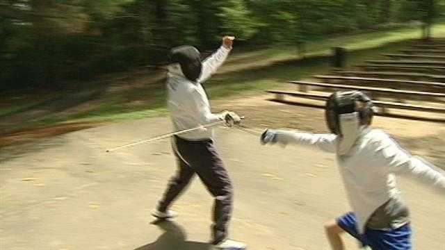 Rob Wu lunges into fencing