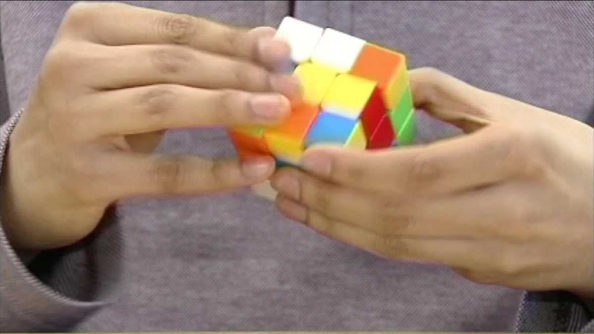 Teen breaks record for blind-solving Rubik's cube