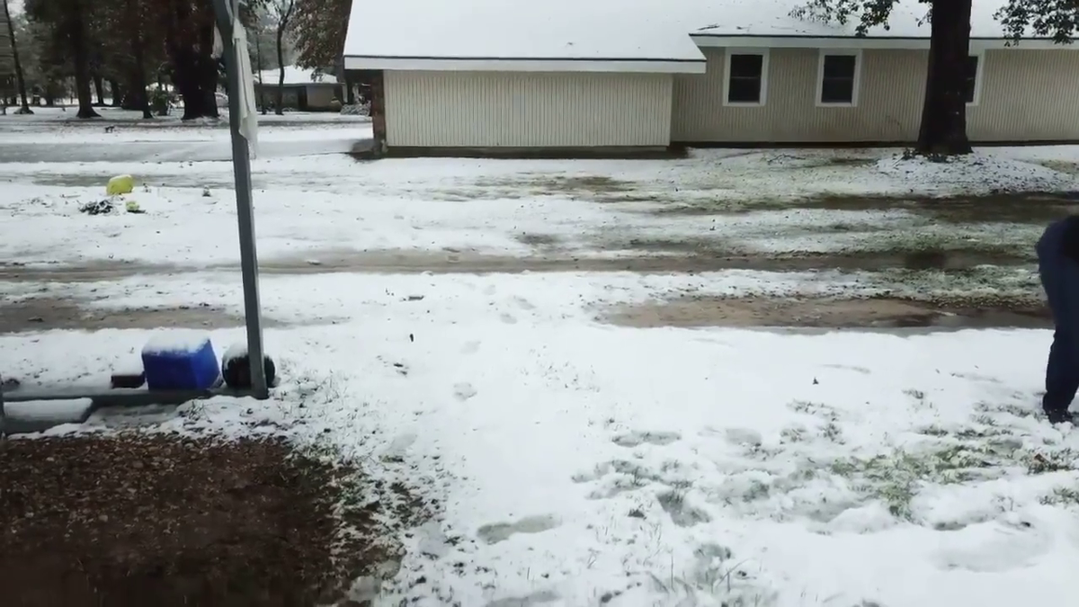 Drone Zooms In as Snowman Being Built in Louisiana