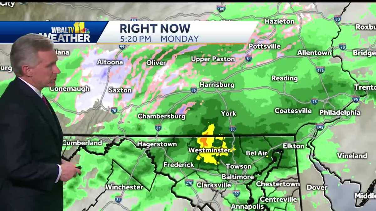 Showers clear late; sleet/snow north of city