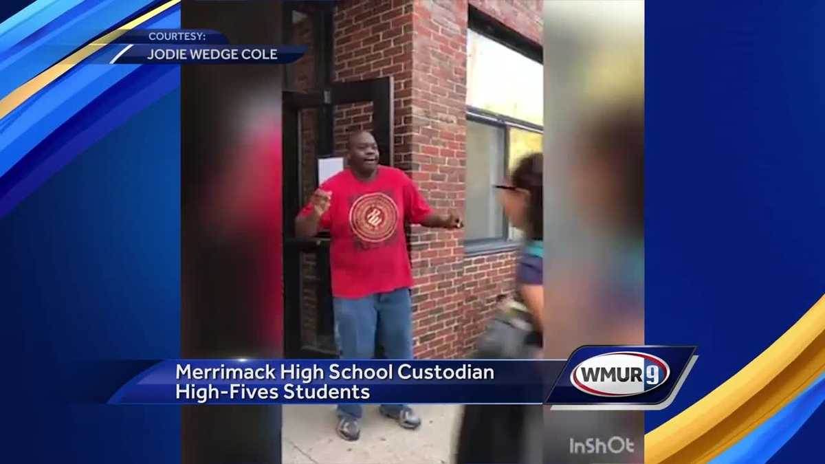 Merrimack High School custodian high fives students