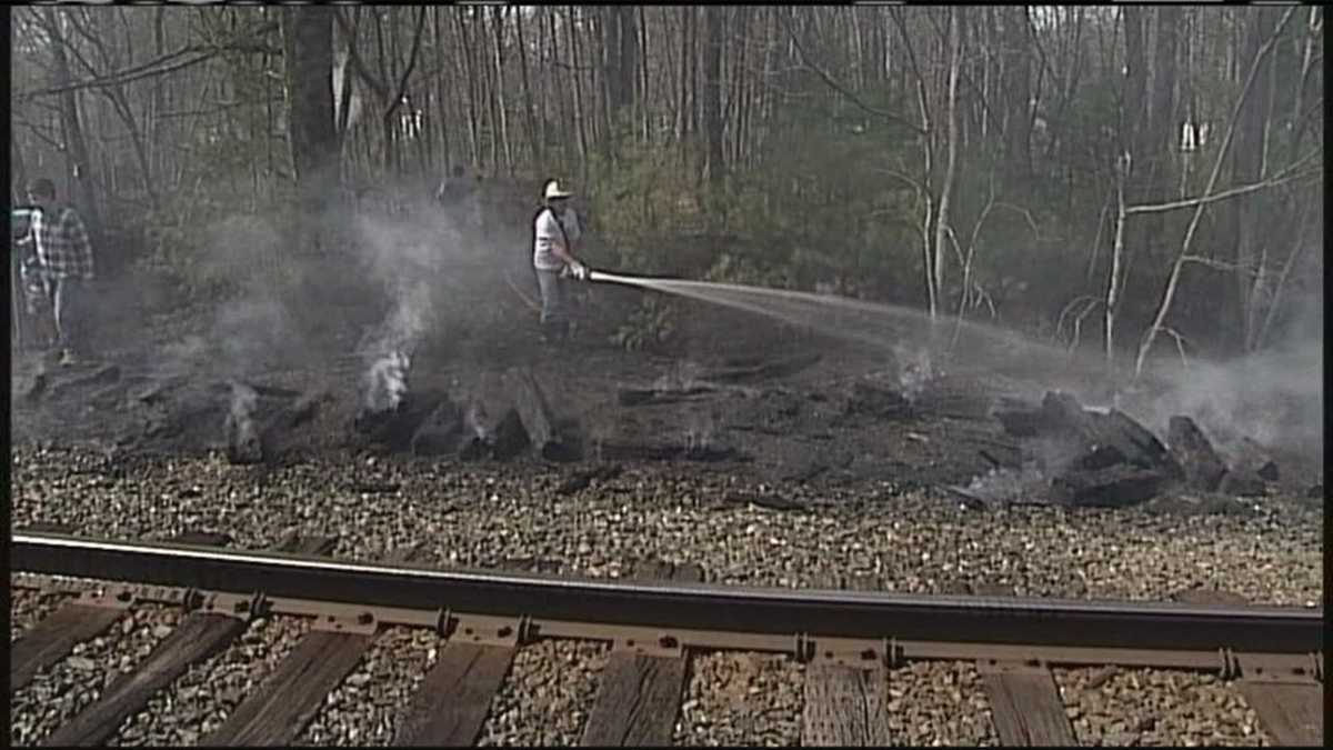 Fire crews search for cause of train track fires