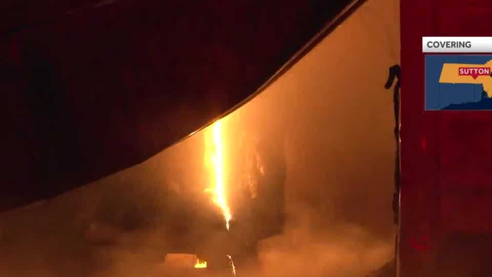 Fire rips through garage at Sutton home