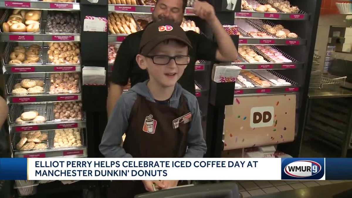 Elliot Perry helps celebrate Iced Coffee Day at Dunkin' in Manchester