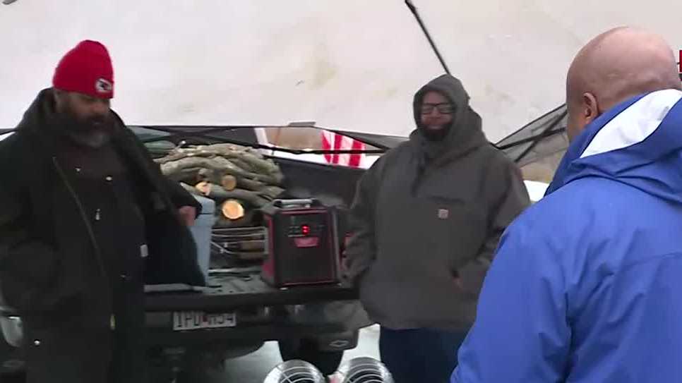 Kansas City Chiefs fans line up at Arrowhead in the rain