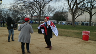 Woman dances at Inauguration with Trump flag