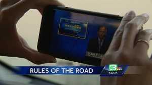 New law: Californians can’t hold phone while driving