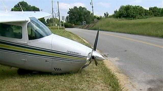 Small plane goes off runway, onto roadway during landing