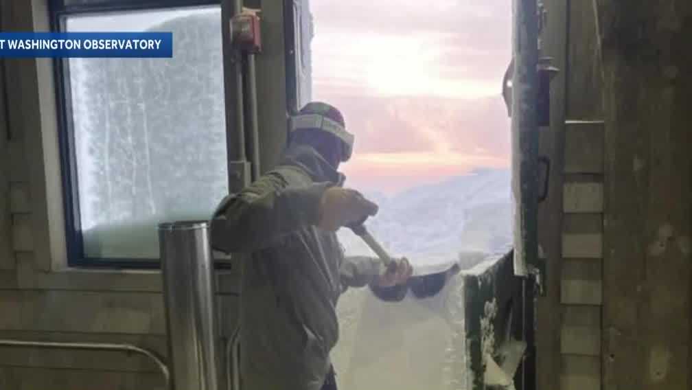 Mount Washington Observatory staff member shovels snow