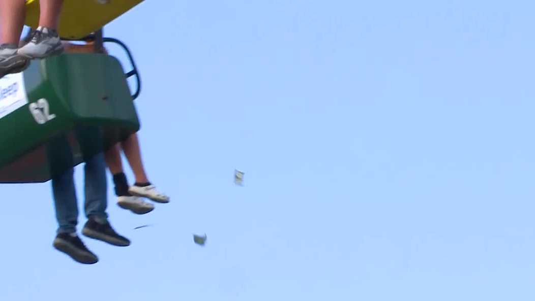 Rider on Iowa State Fair Sky Glider drops cash to crowd below