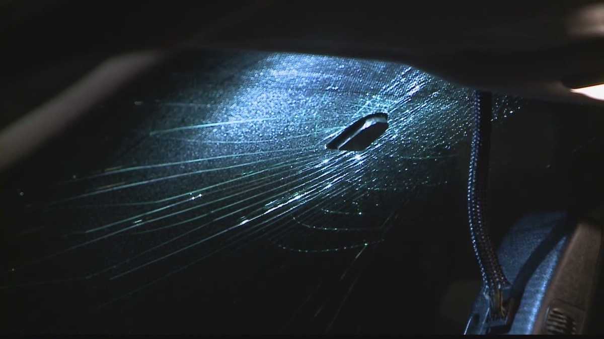 Driver says object thrown from overpass damaged his car