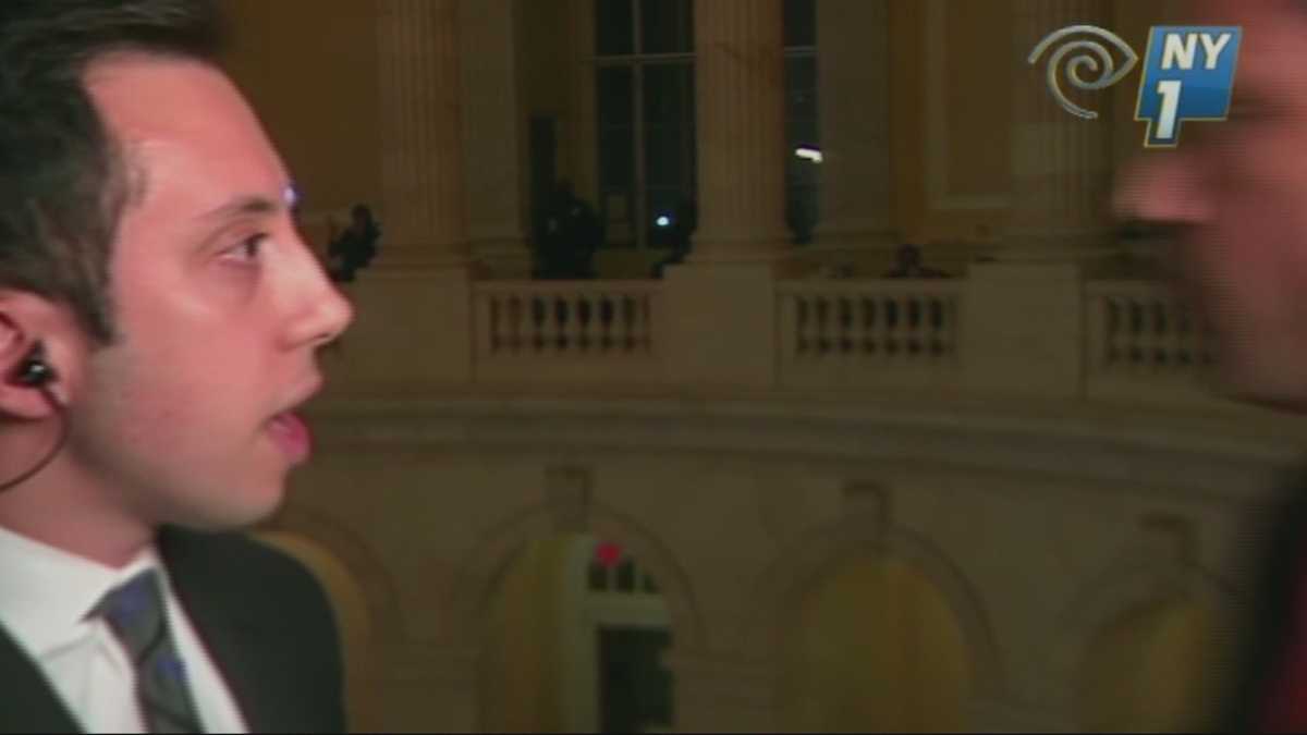 Congressman threatens to throw reporter off balcony