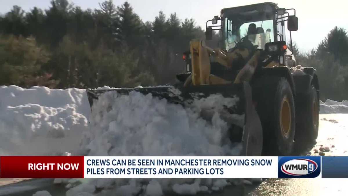 Crews continue to clear snow from parking lots, sidewalks