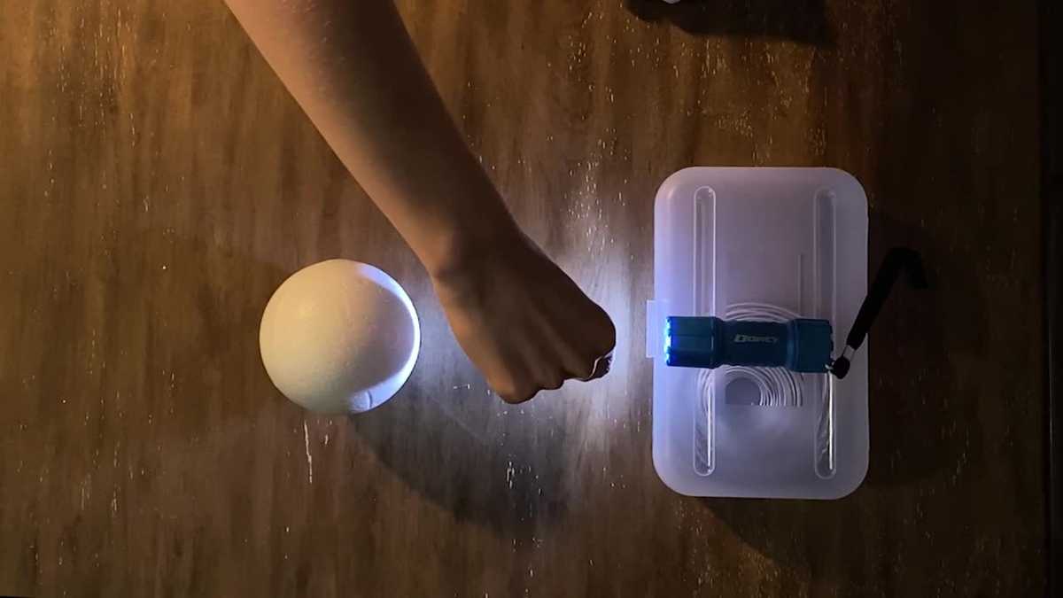 Mimic how an eclipse happens with flashlight, sports balls