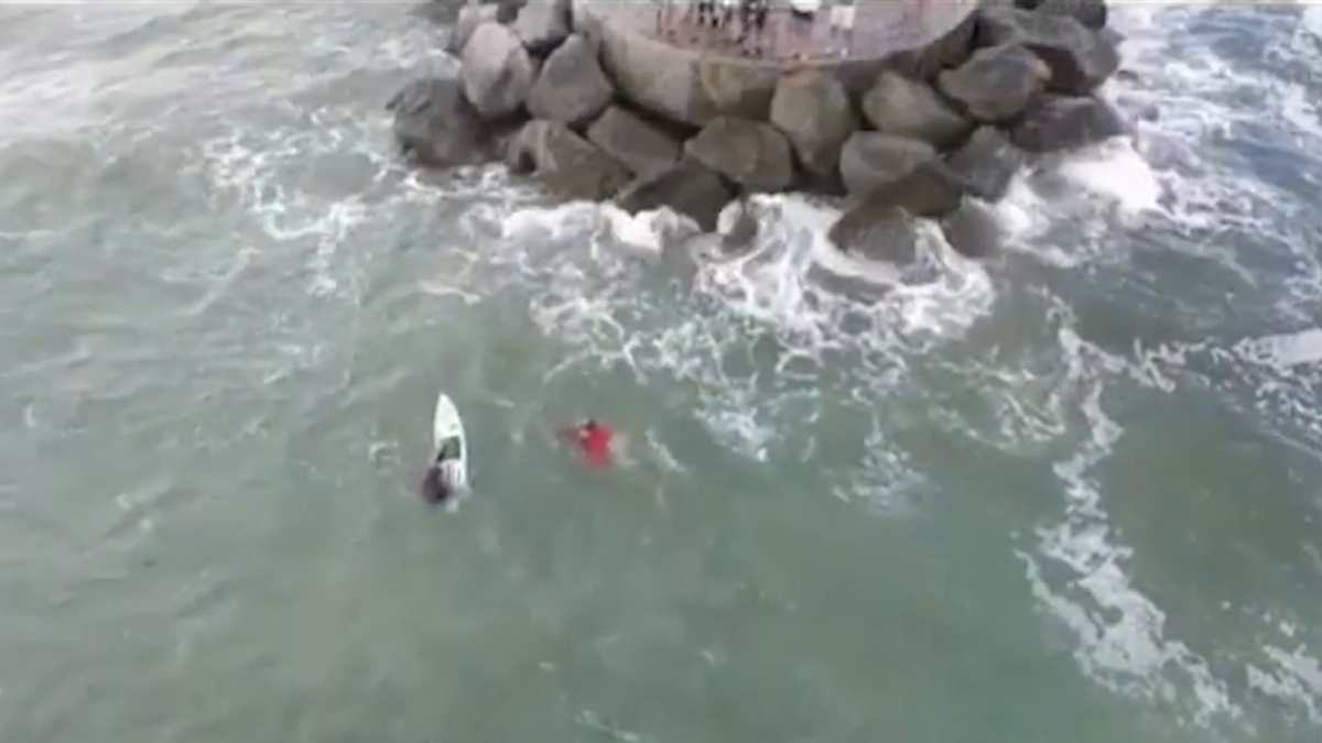Teenager jumps into ocean to save man after his boat capsizes