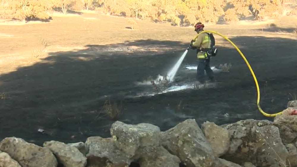 Grass fire burns close to Solano County homes as crews battle flames