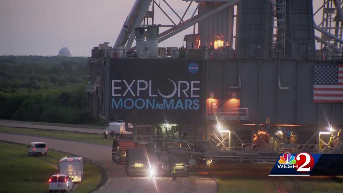 Moon launcher slowly rolls to launch pad at Kennedy Space Center