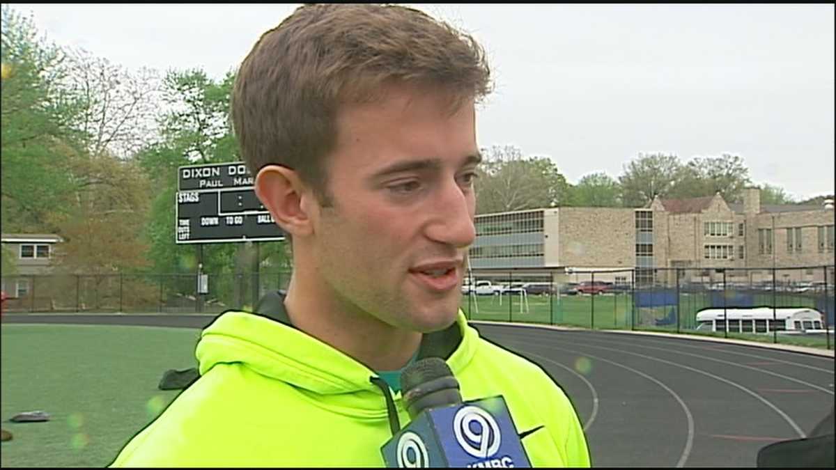 Bishop Miege's Liam Bryson makes adjustments after football injury
