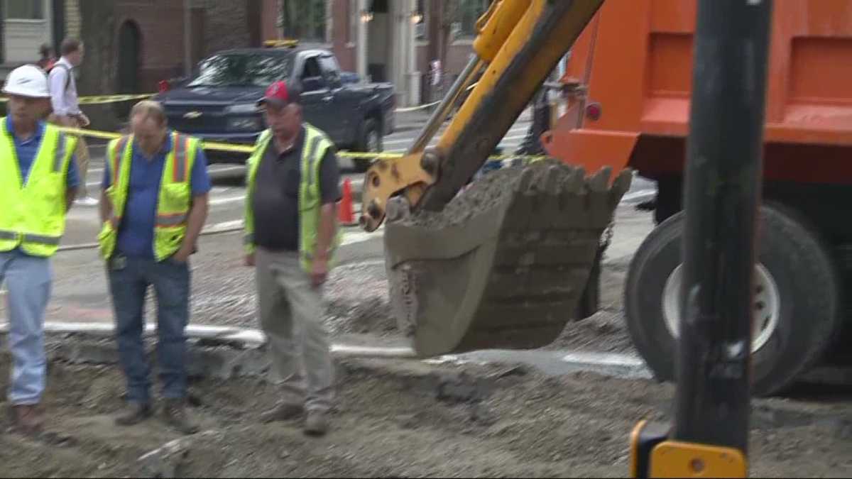 Man falls into sinkhole after massive water main break