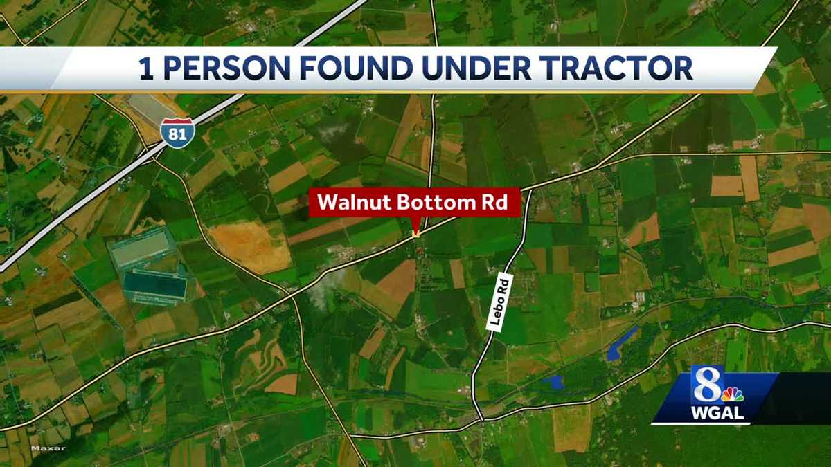 Person trapped under tractor, coroner called
