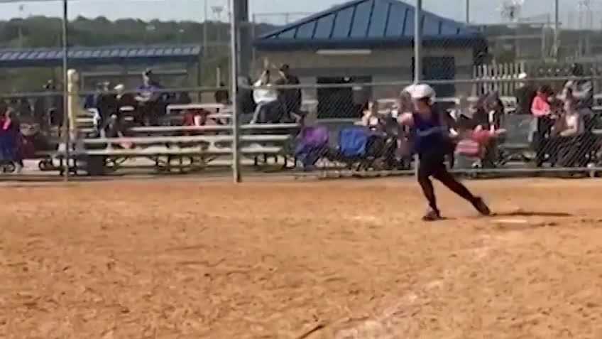 Softball player lays down impressive slap bunt