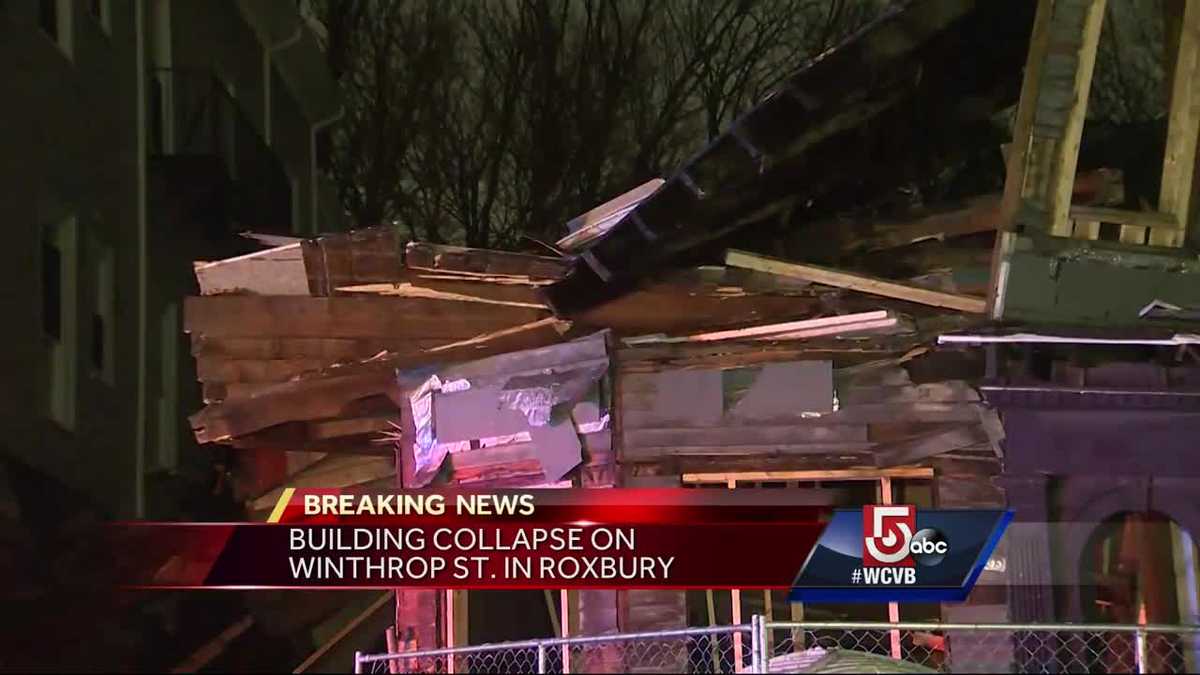 Building comes crashing down, hitting neighborhing home