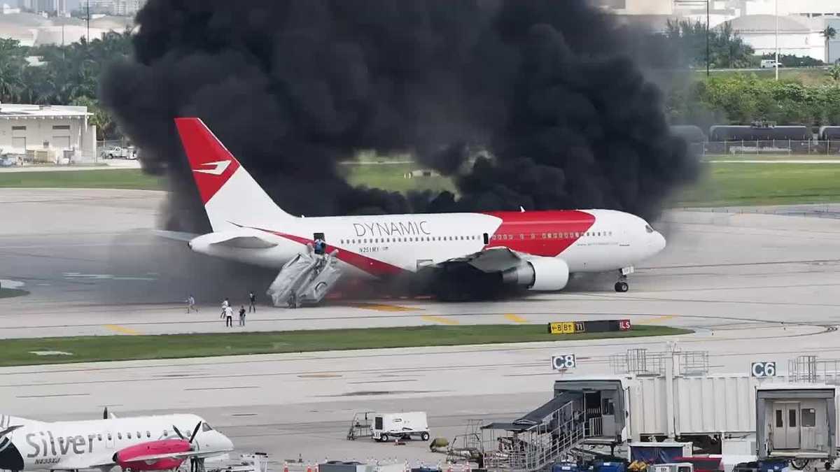 Dramatic video shows people escaping plane on fire