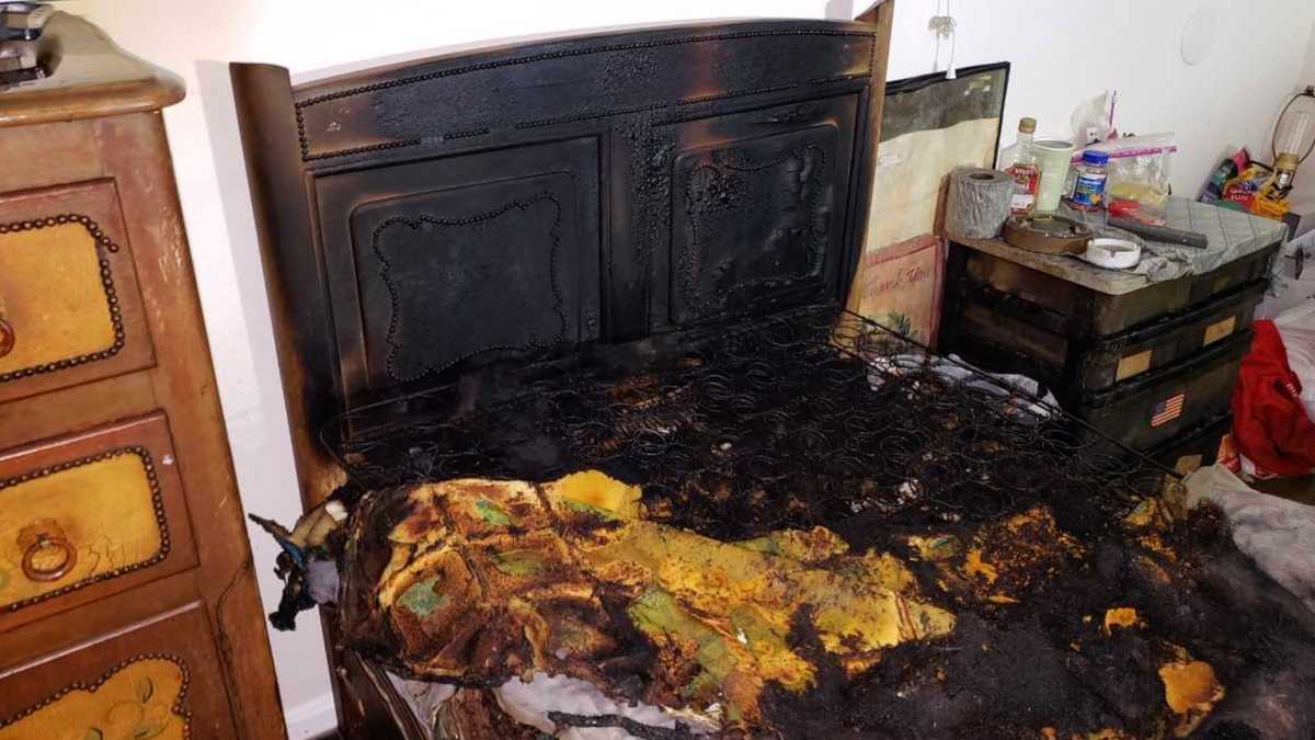 Woman saved from burning bed after falling asleep while smoking