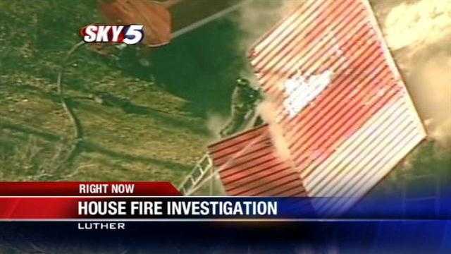 Crews battle Luther house fire