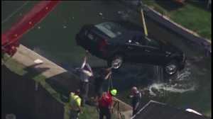 Man, grandson escape after car crashes into pool