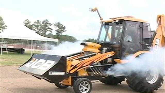 Drag racing backhoe draws a crowd