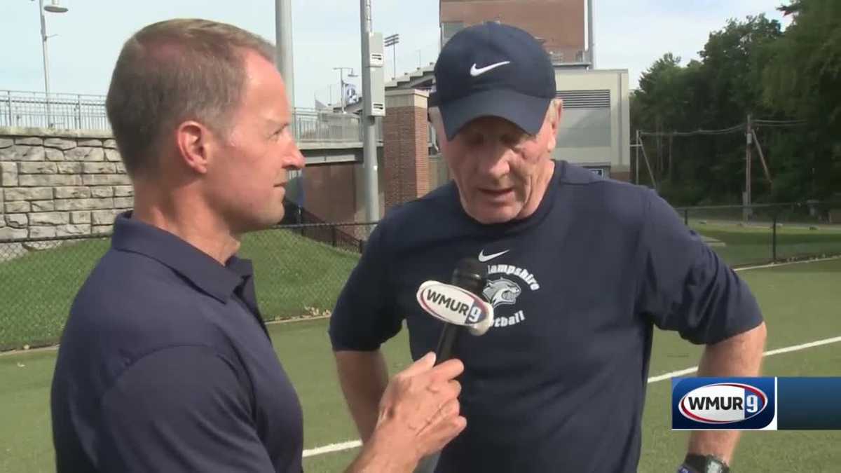 Jason King talks with UNH football coach Sean McDonnell