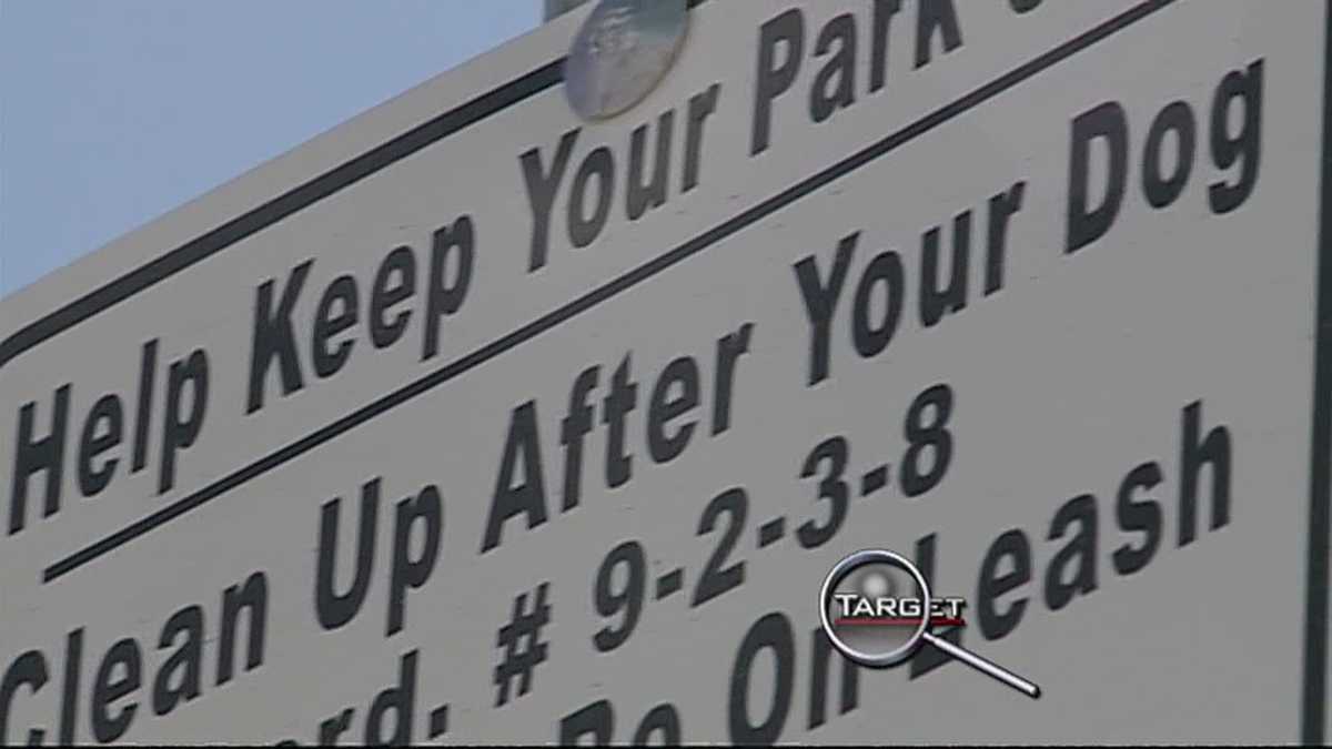 Signs beckon residents to curb their dogs