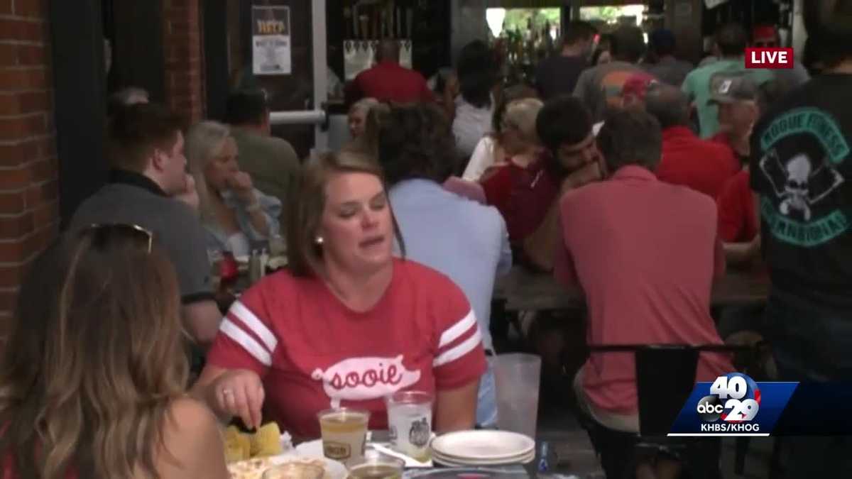 Hog fans cheer on the Razorbacks from Fayetteville