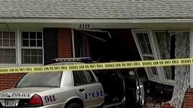 Police car crashes into house on Outer Loop