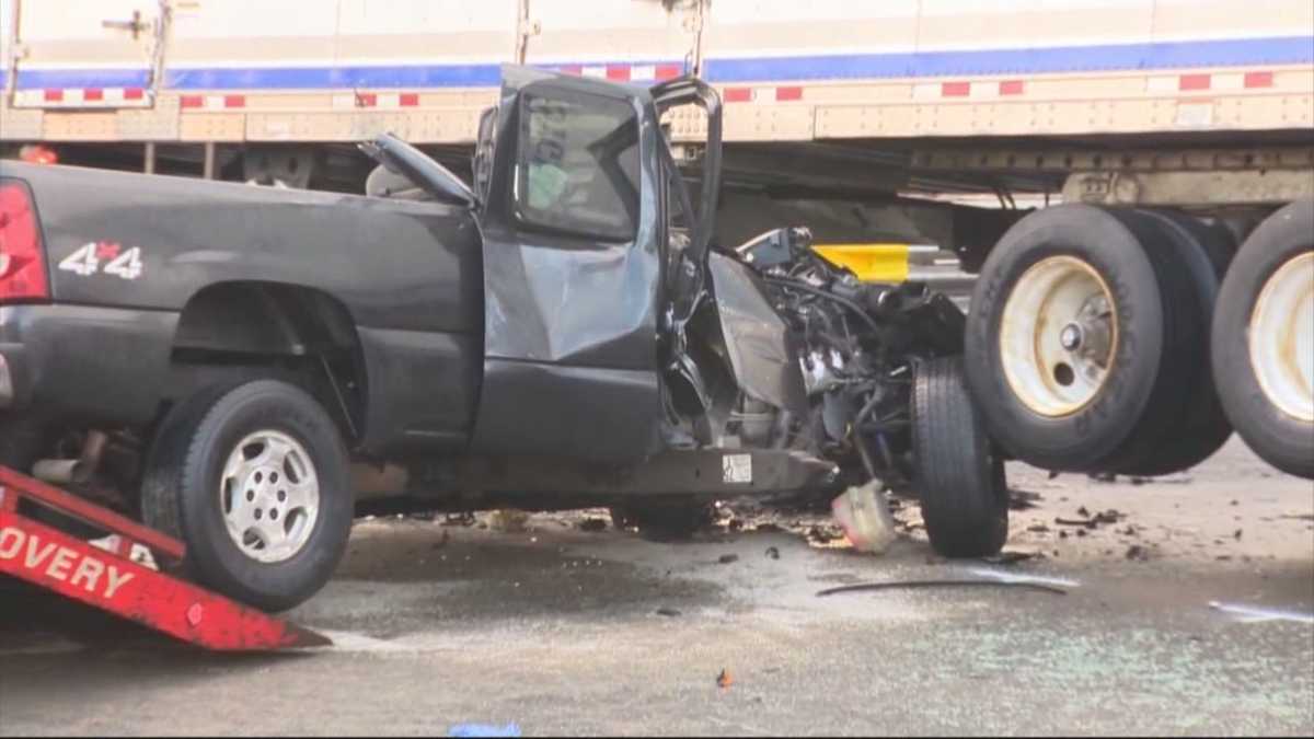 Man rescued after being pinned under tractor-trailer