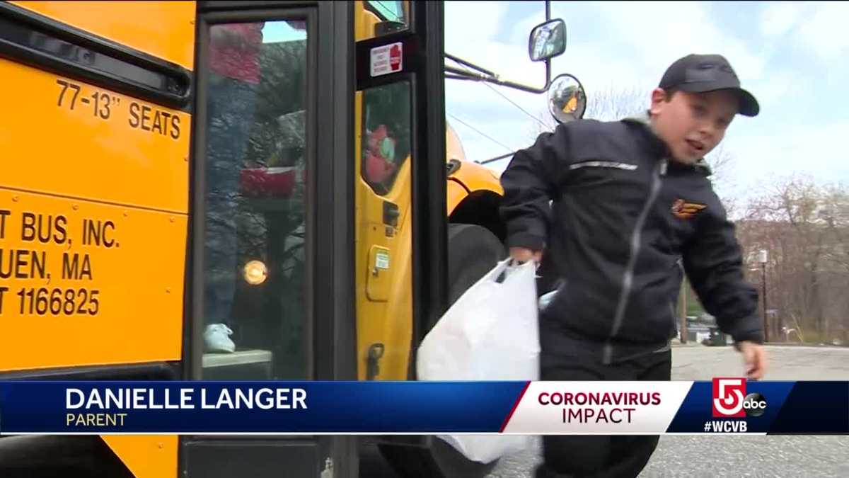 School bus drivers delivering meals for families along routes