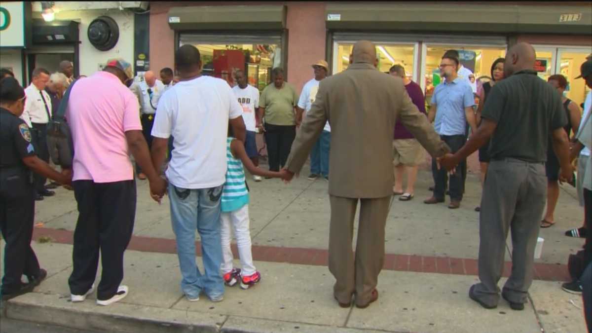 Community prays for peace after triple shooting