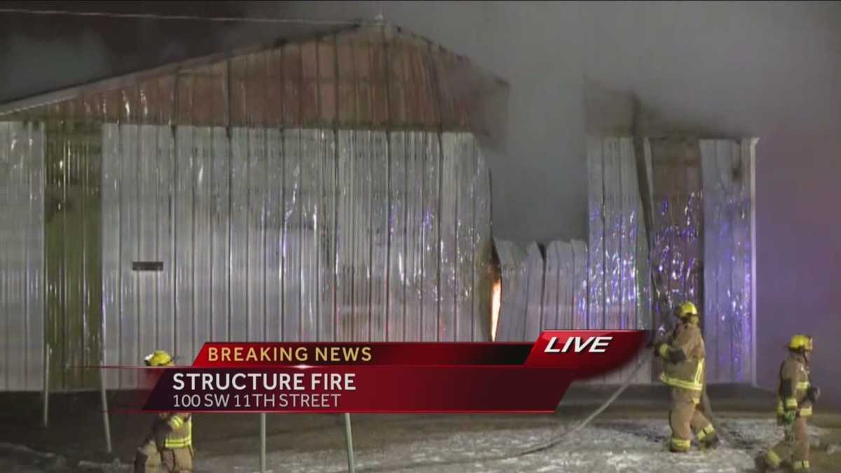 Explosion causes building collapse as crews battle blaze