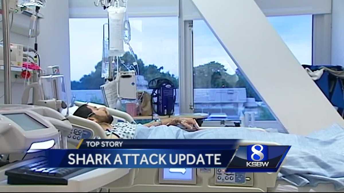Shark attack victim's father 'happy' after surgery