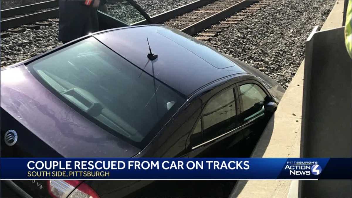 Two rescued after vehicle became stuck on railroad tracks
