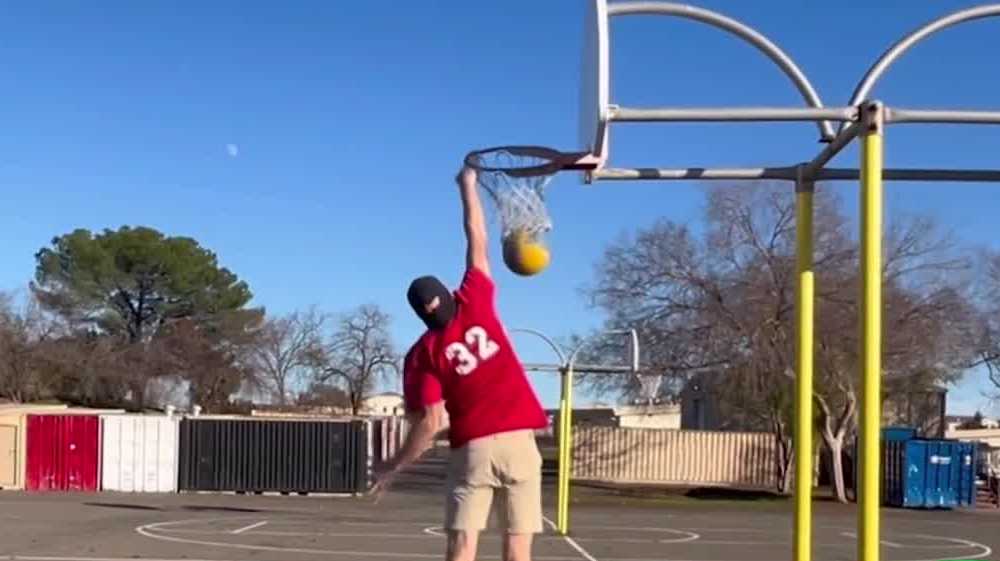 Video: Dad proves to kid he can still dunk for 55th birthday
