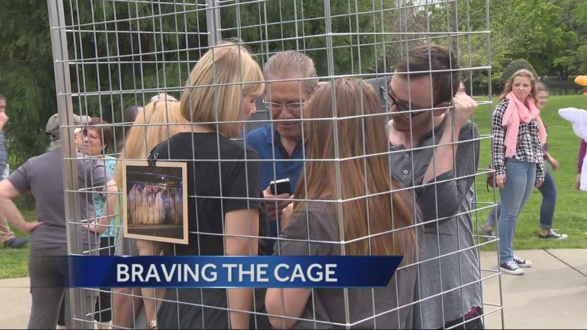 Why are these people in chicken cages at the Capitol?