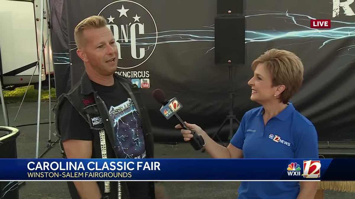 Lanie Pope gets a juggling lesson from acrobat and performer Shane Hansen