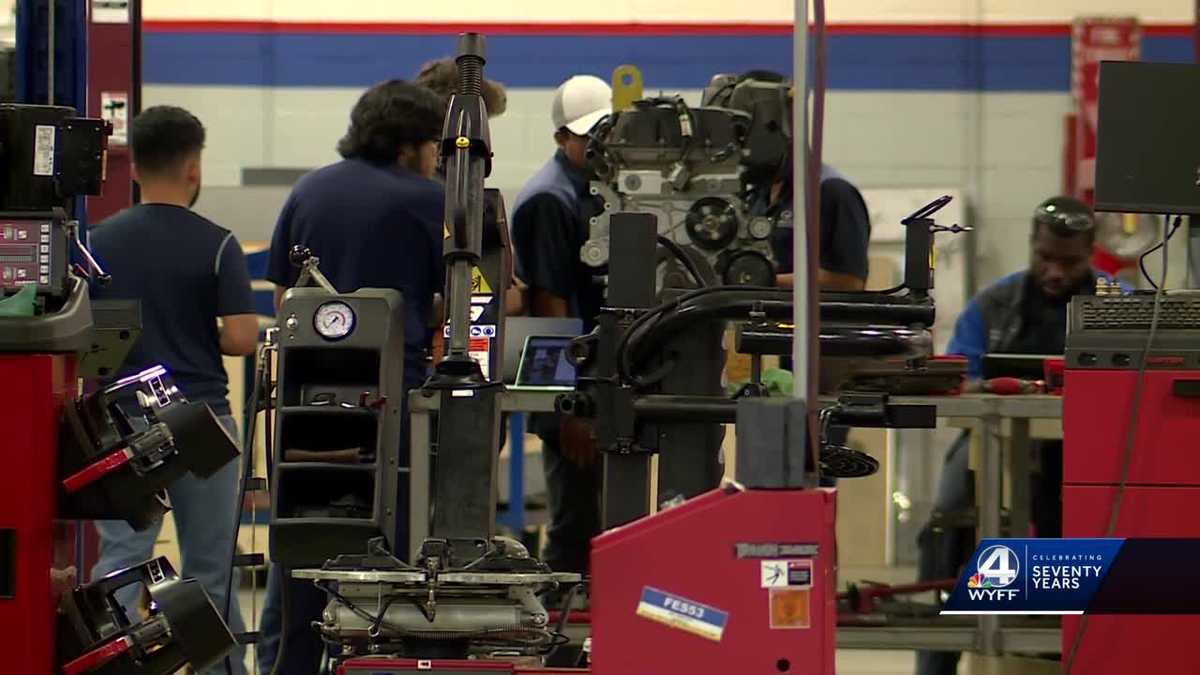 Grant teaches automotive students to service electric vehicles