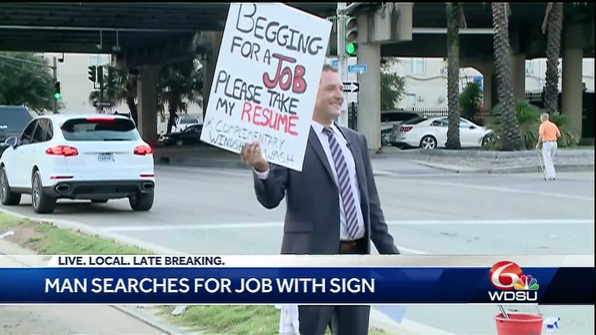 Searching for a job with a sign