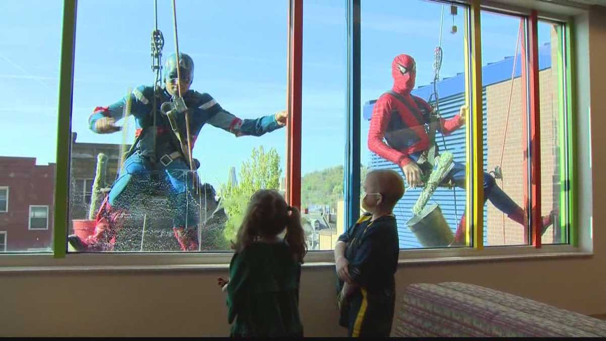 Superhero window-washers thrill Children's Hospital patients